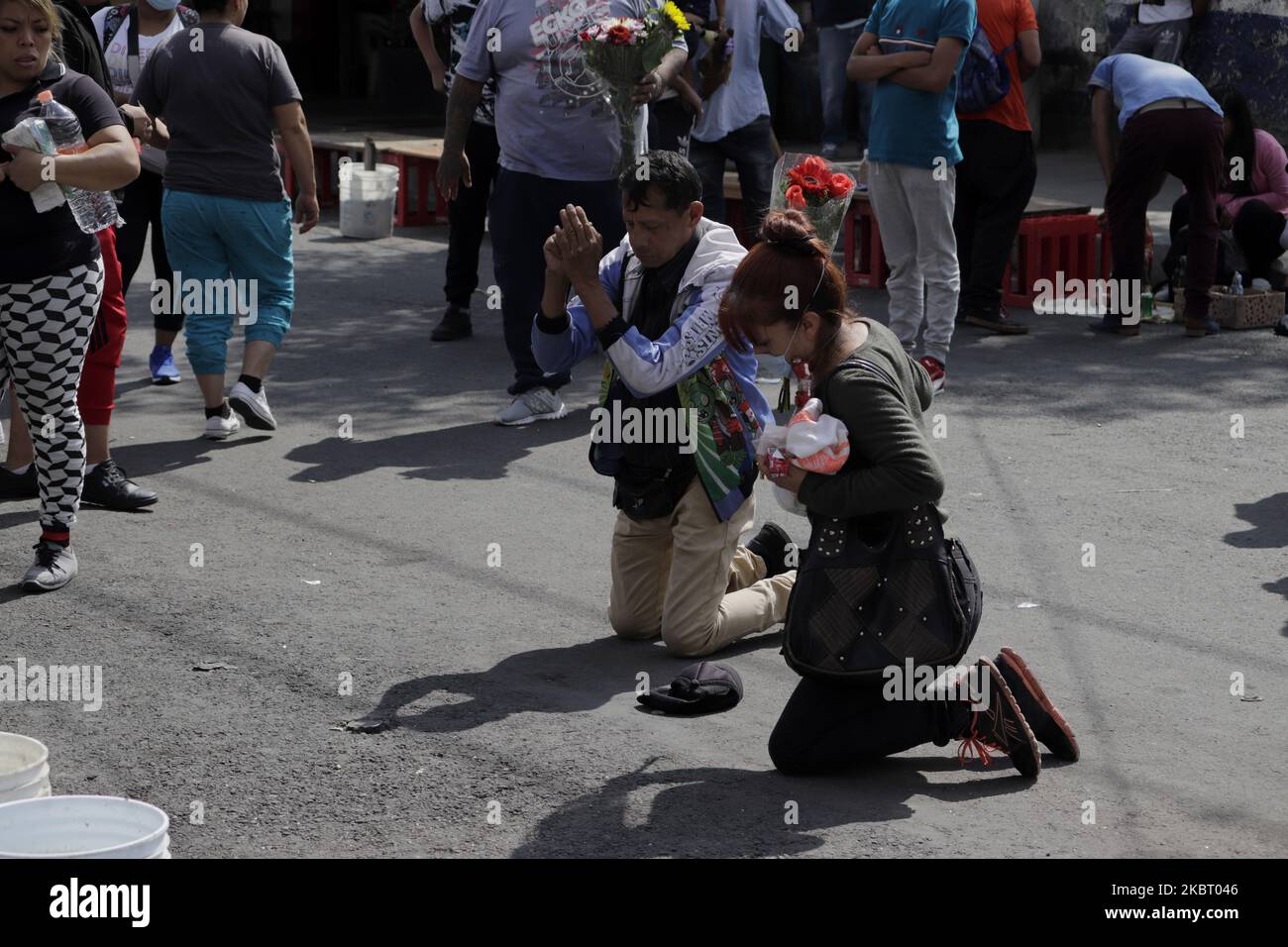 Believers of Santa Muerte, visit their temple on their knees located in ...