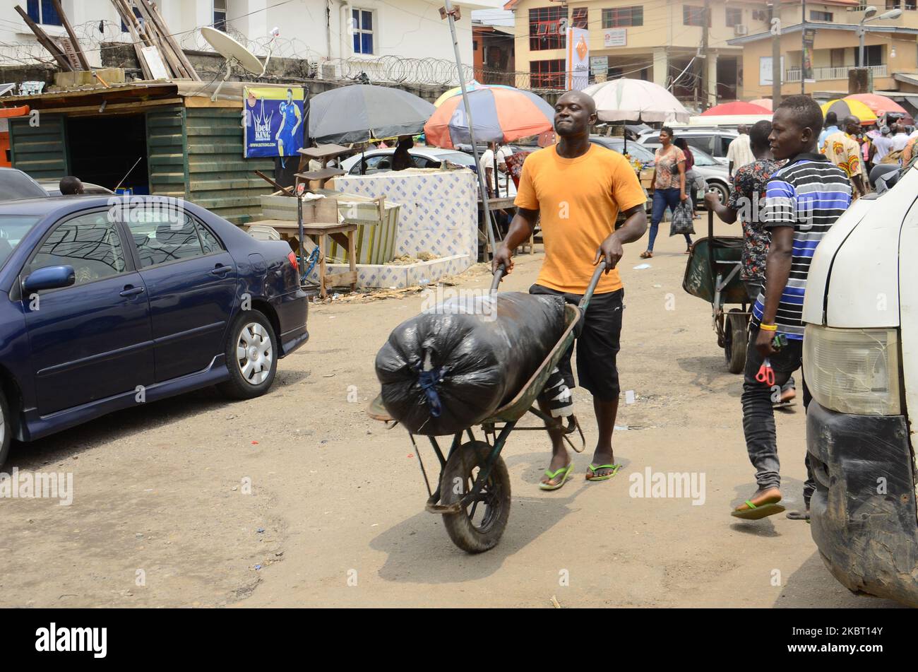 Travelers arriving at at Opebi/Onigbongbo branch B Owena park Ojota bus ...