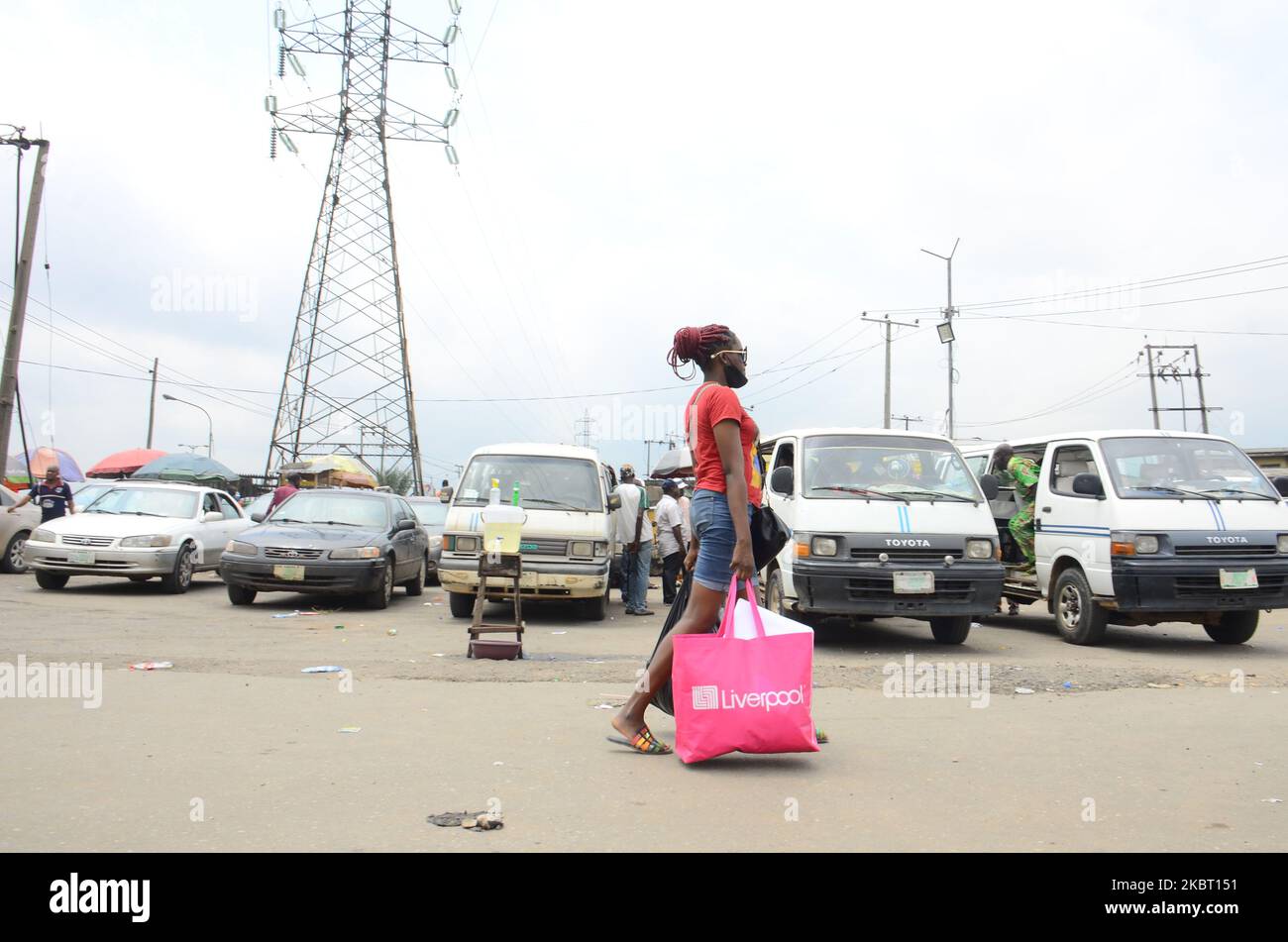 Travelers arriving at at Opebi/Onigbongbo branch B Owena park Ojota bus ...