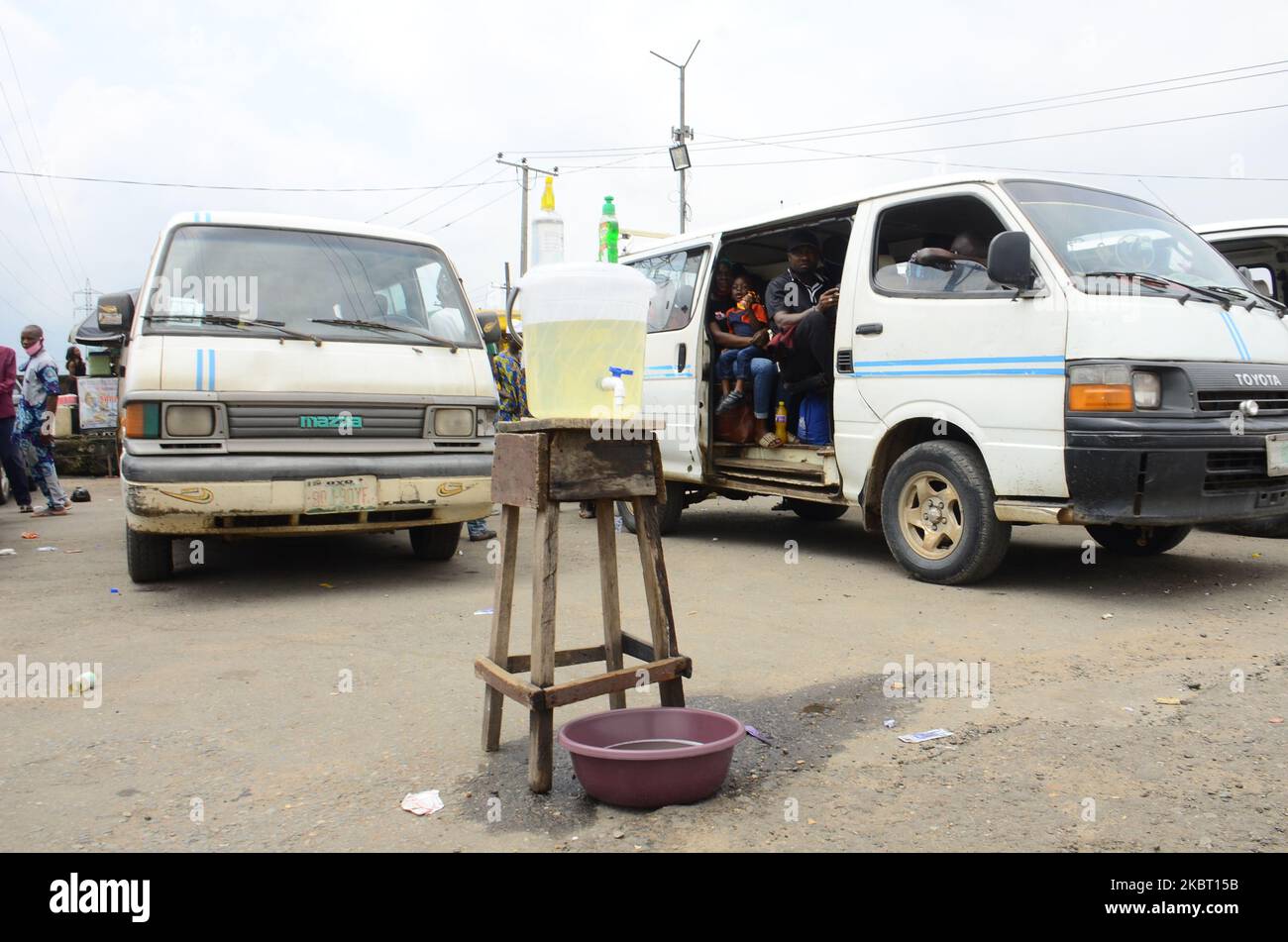 Hand sanitizer displayed on a bench for travellers in compliance with ...