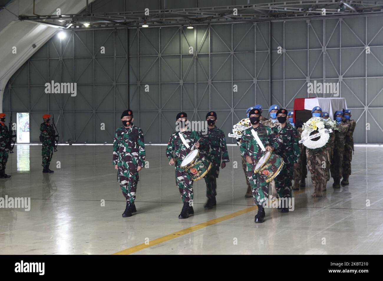 A military honor guard dressed in UN task force carry the casket of Sgt ...
