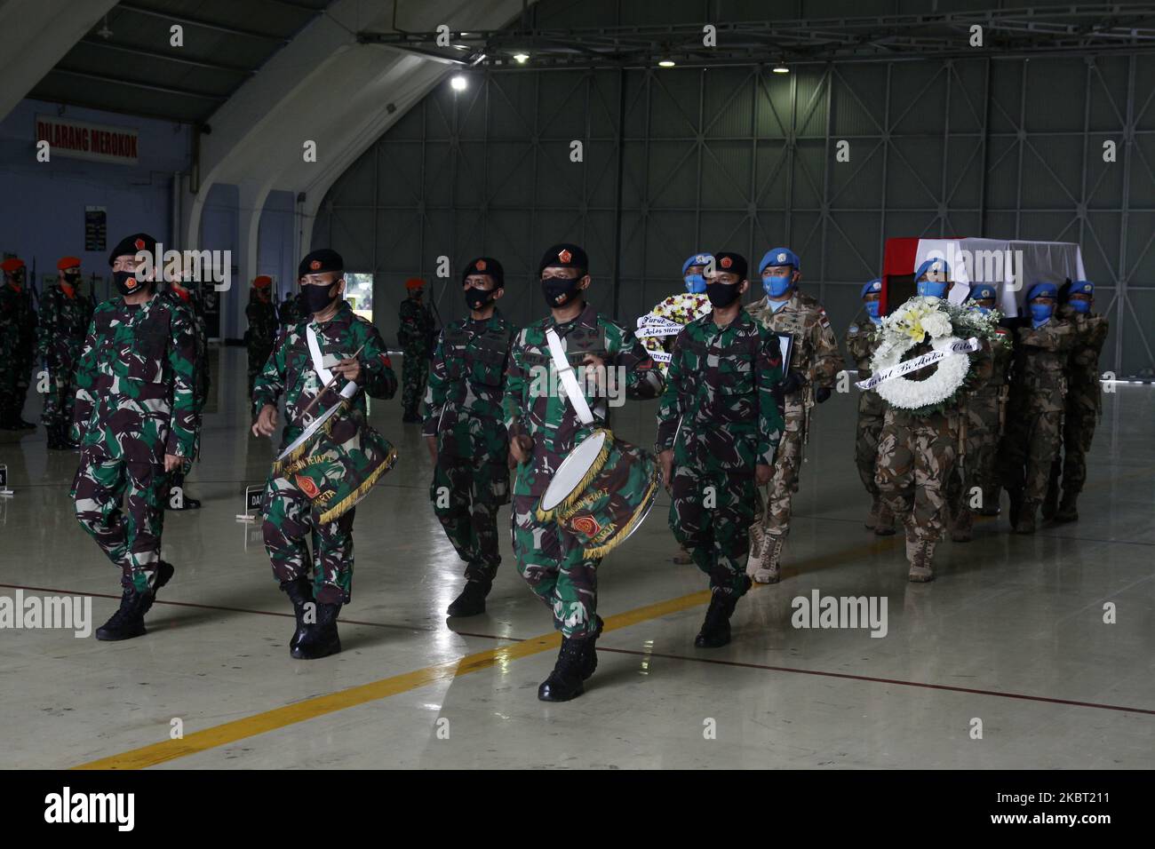 A military honor guard dressed in UN task force carry the casket of Sgt ...
