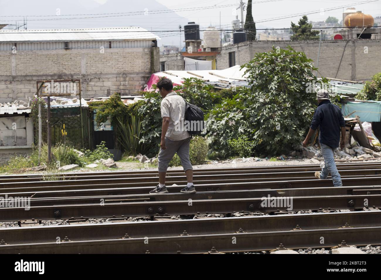 Central American migrants wait for the train called ''La bestia'' ( The ...