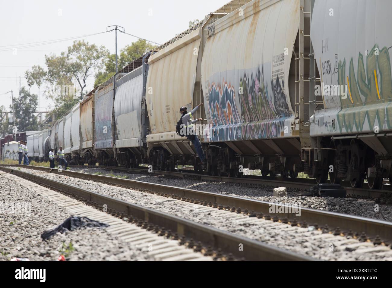 Central American migrants wait for the train called ''La bestia'' ( The ...