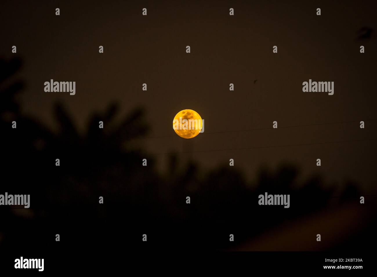 Full moon rises over Ungaran, Central Java Province, Indonesia at the ...