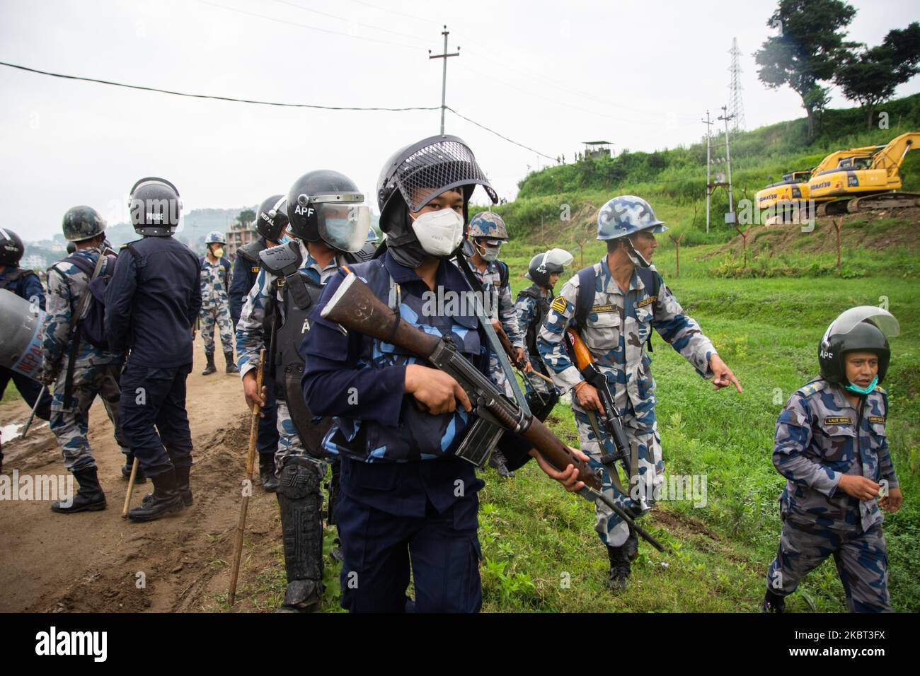 Nepalese policemen disperse demonstrators during a protest that turned ...