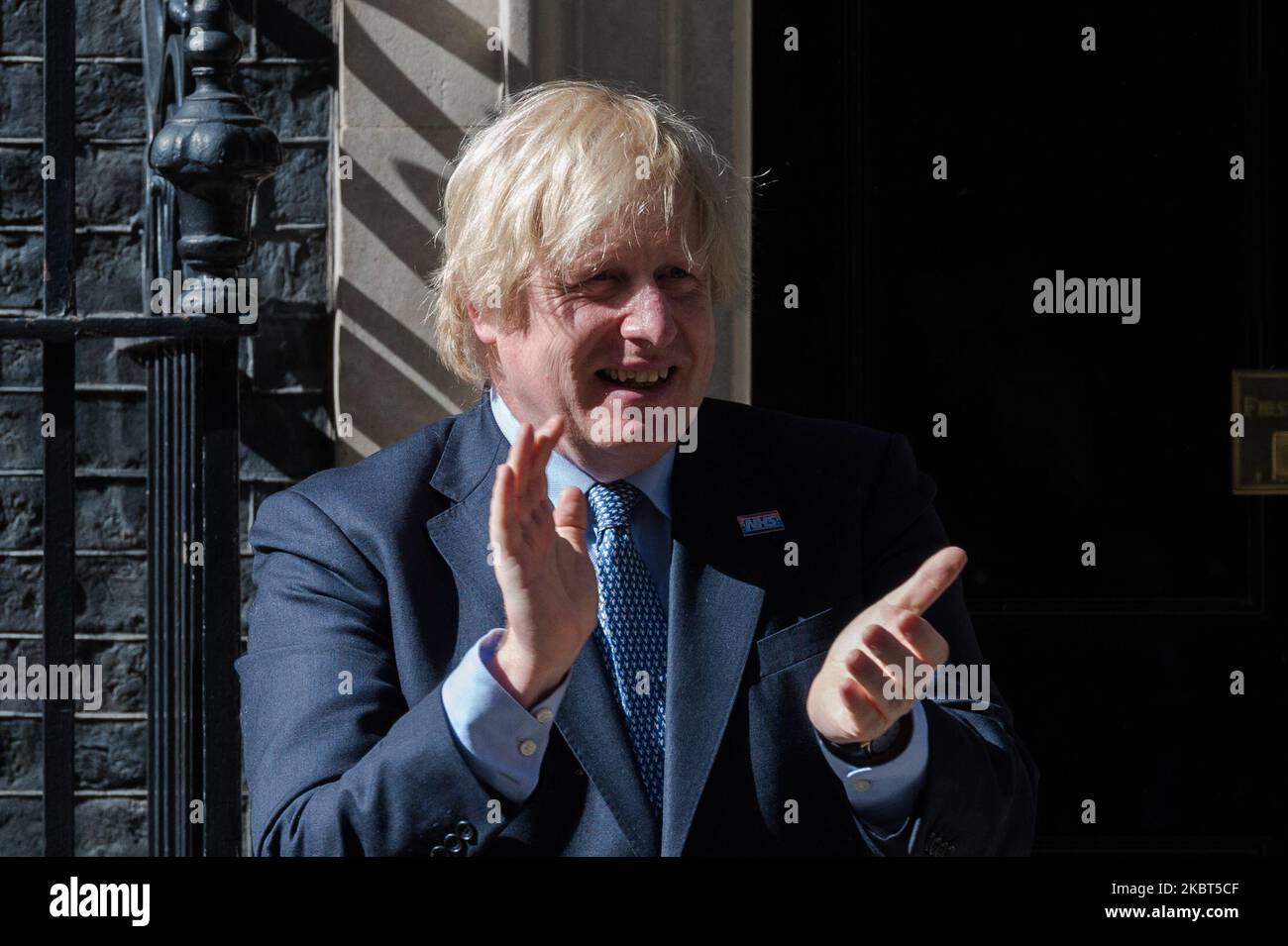 British Prime Minister Boris Johnson claps hands outside 10 Downing ...