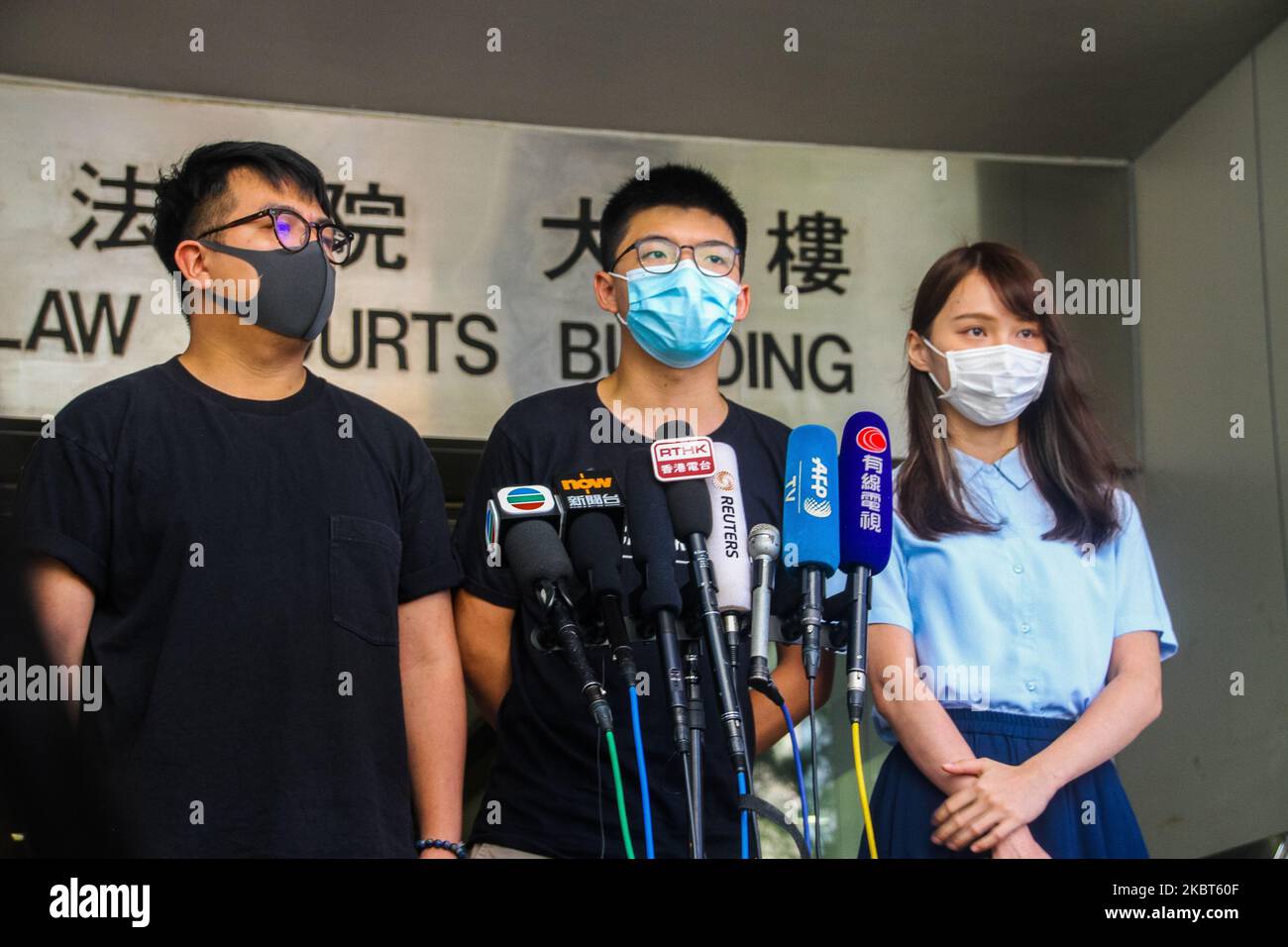 Ivan Lam, Joshua Wong and Agnes Chow speak to the press outside Eastern ...