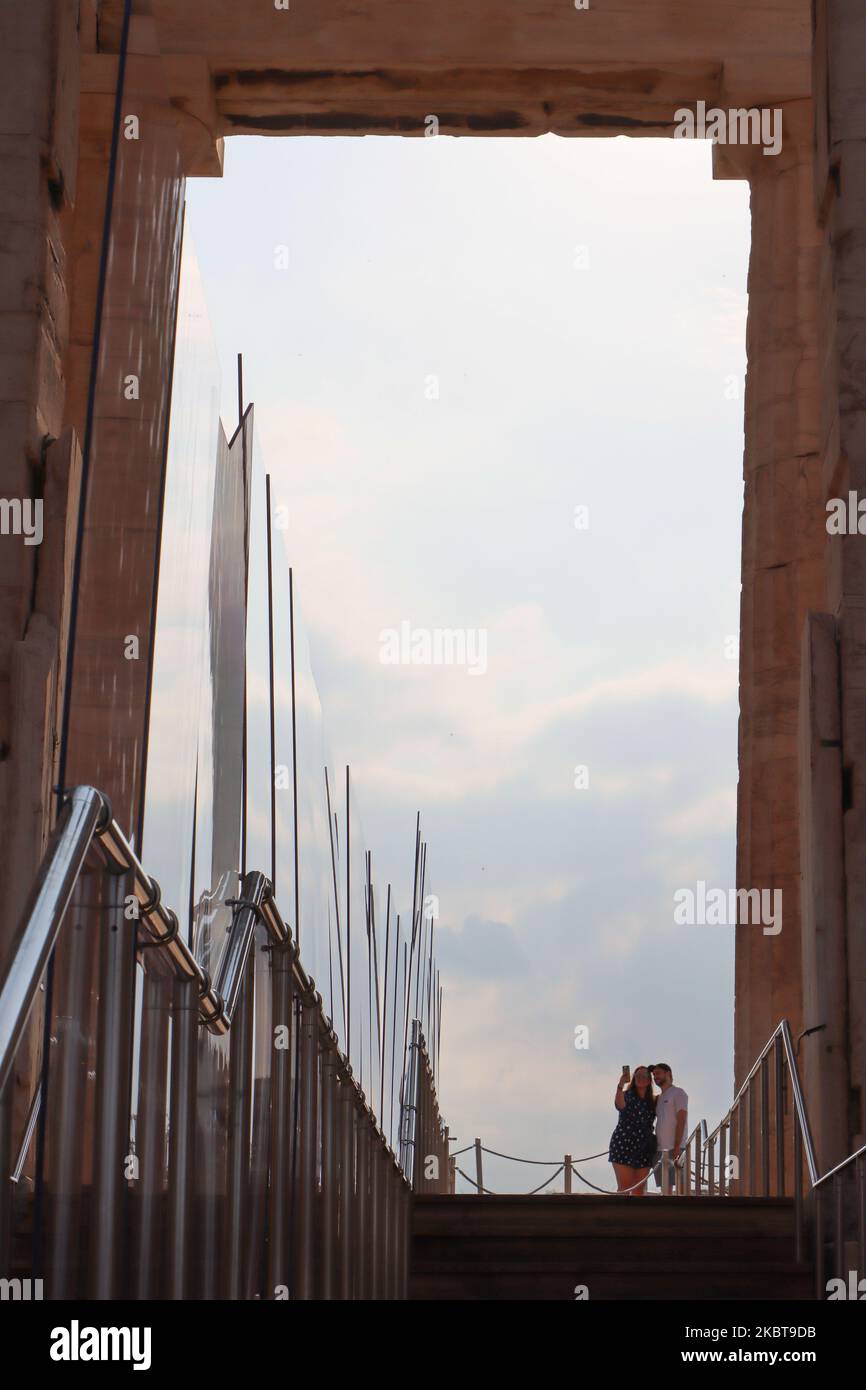 Few tourists as seen visiting the Acropolis comparing the to ...
