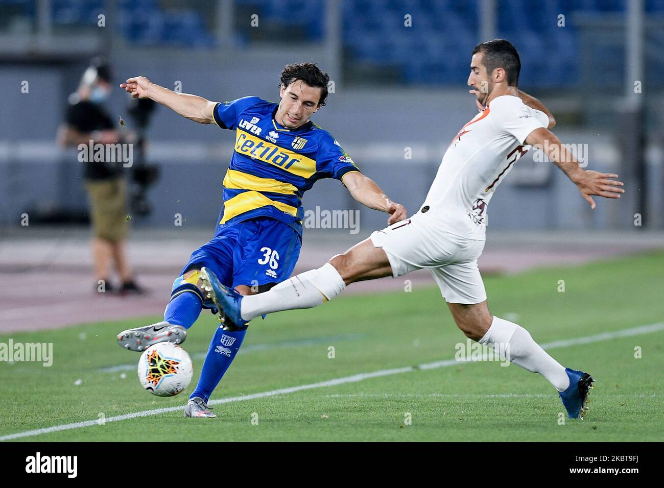 Matteo Darmian of Parma Calcio is challenged by Henrikh Mkhitaryan of ...