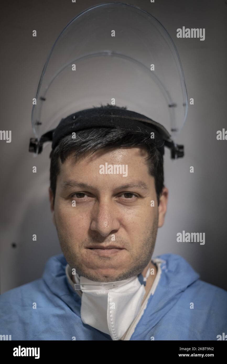 Iranian medical personnel, Mojtaba Samadi, 38, wearing protective ...