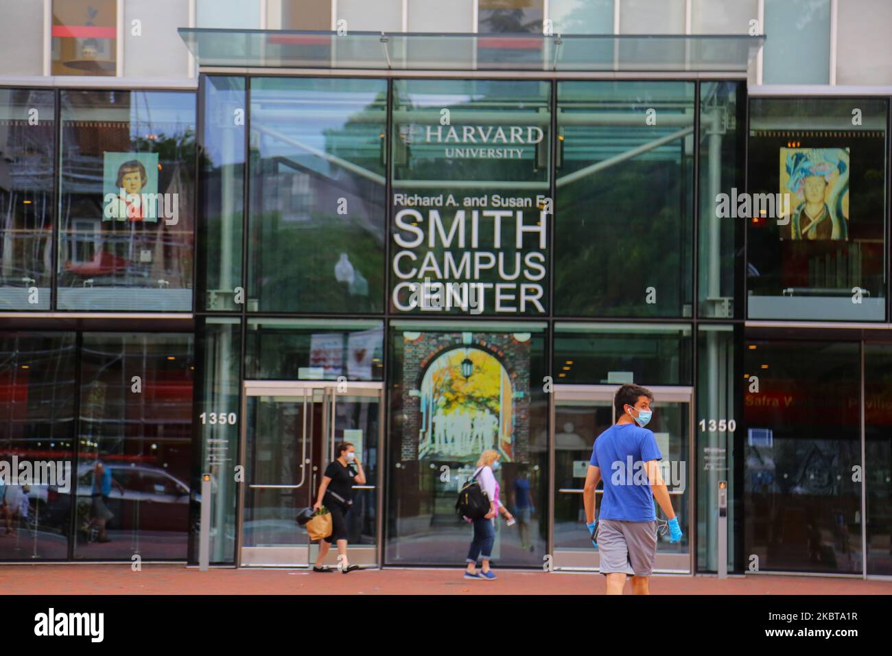 A boy (L) looks back while heading to Smith Campus Center at Harvard ...
