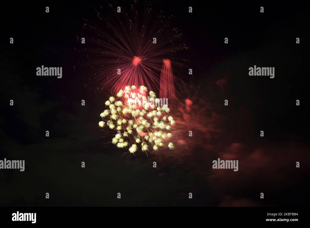 Aerial view of bright fireworks exploding with colorful lights against ...