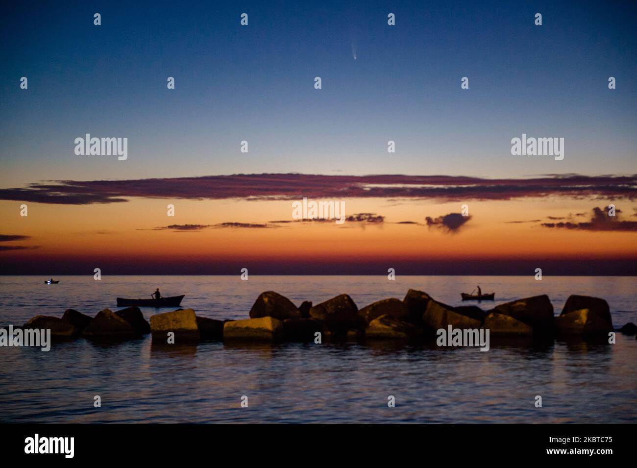 Comet Neowise (C/2020 F3) shining at sunset above the Port of Molfetta ...