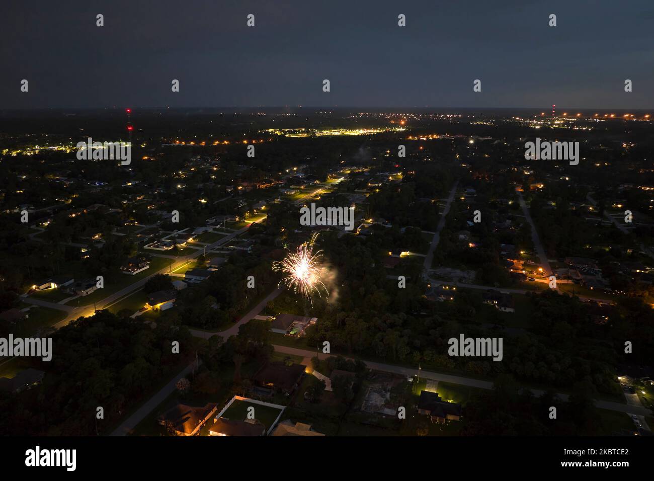 Aerial view of bright fireworks exploding with colorful lights over ...