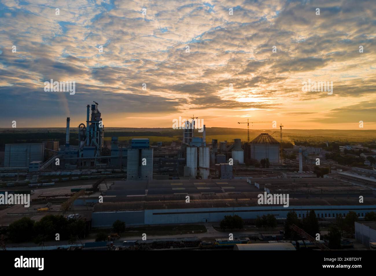 Aerial view of cement factory tower with high concrete plant structure ...