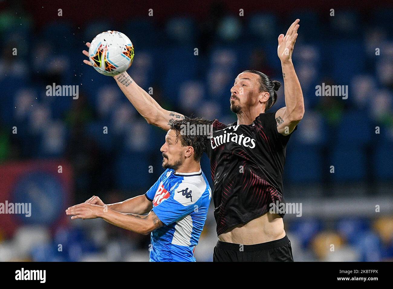 Zlatan Ibrahimovic of AC Milan and Mario Rui of SSC Napoli fight for ...