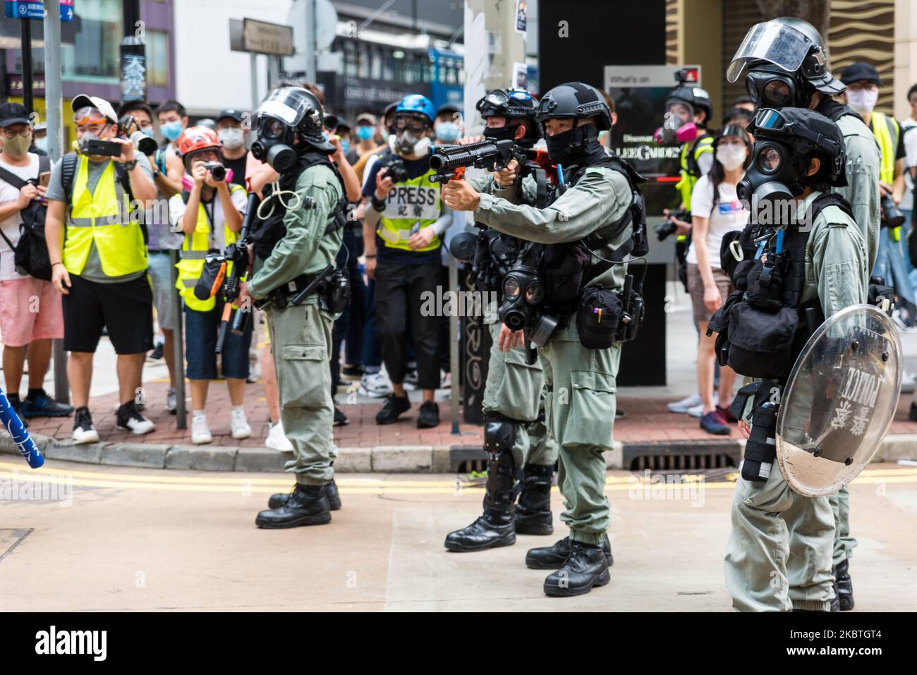 A policeman points a sponge ball gun in Hong Kong, China, 24 May 2020 ...