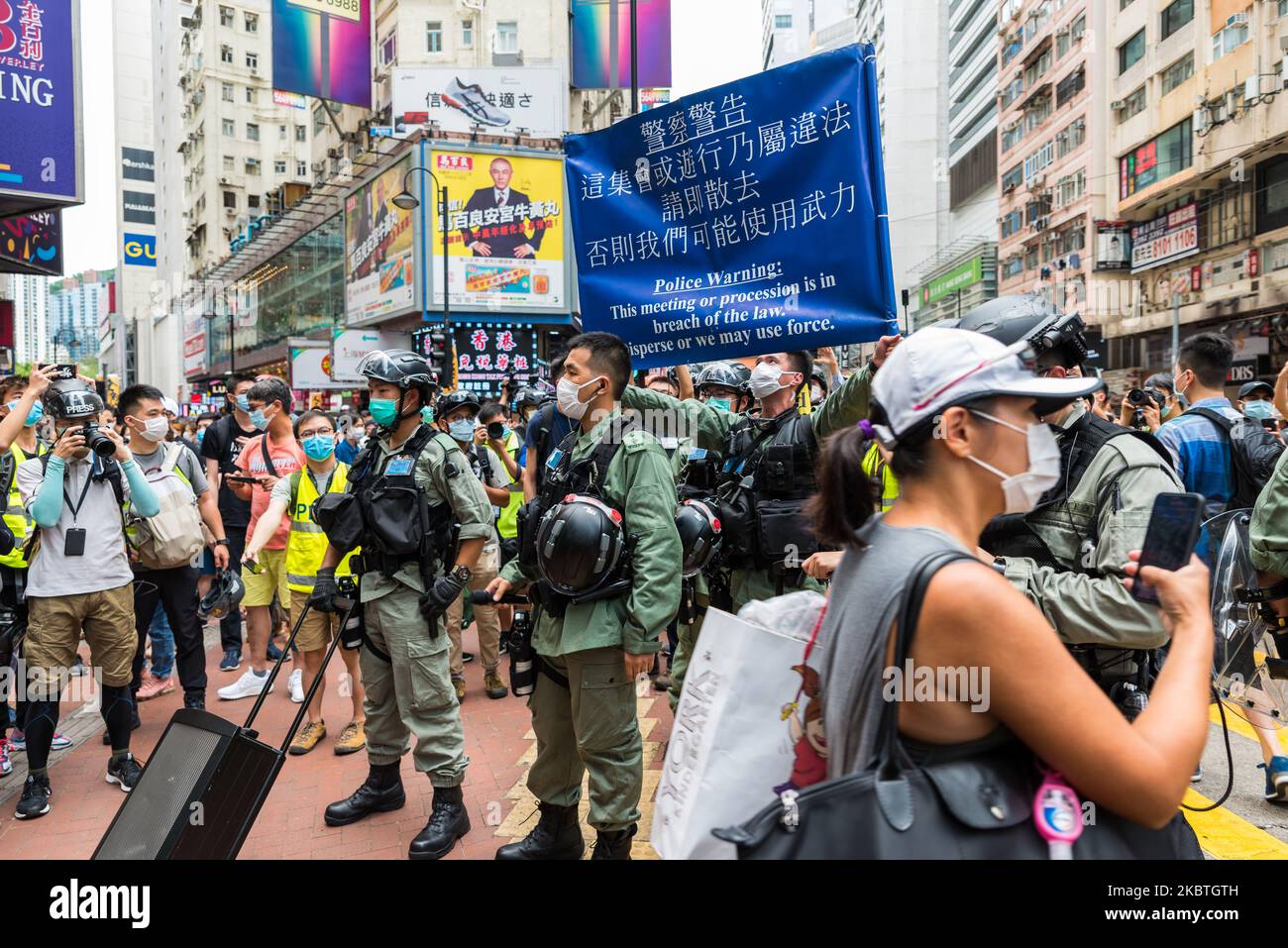 Riot police deploy the blue flag warning of unlawful assembly in Hong ...