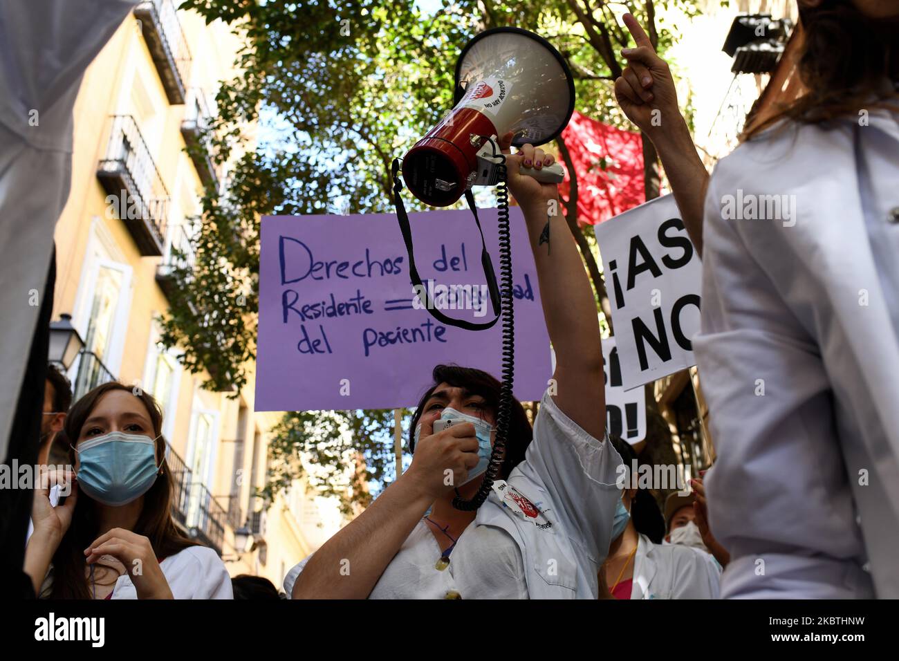 A healthcare worker hold a placard reading `Rights resident doctors ...