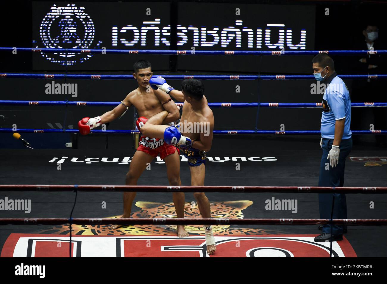 Muaythai boxers fight in front of empty spectator seats behind closed ...