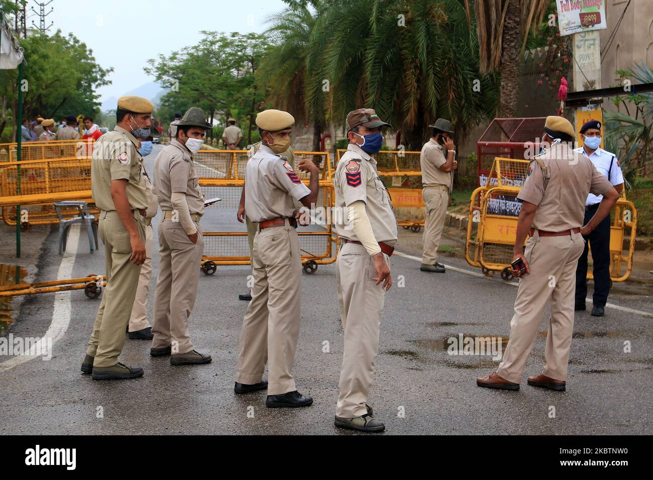 Security personnel stand guard outside a hotel where Congress leaders and MLA are staying in ...