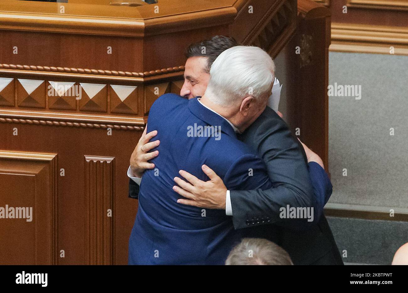 The first president of Ukraine Leonid Kravchuk (L) gives a hug to ...