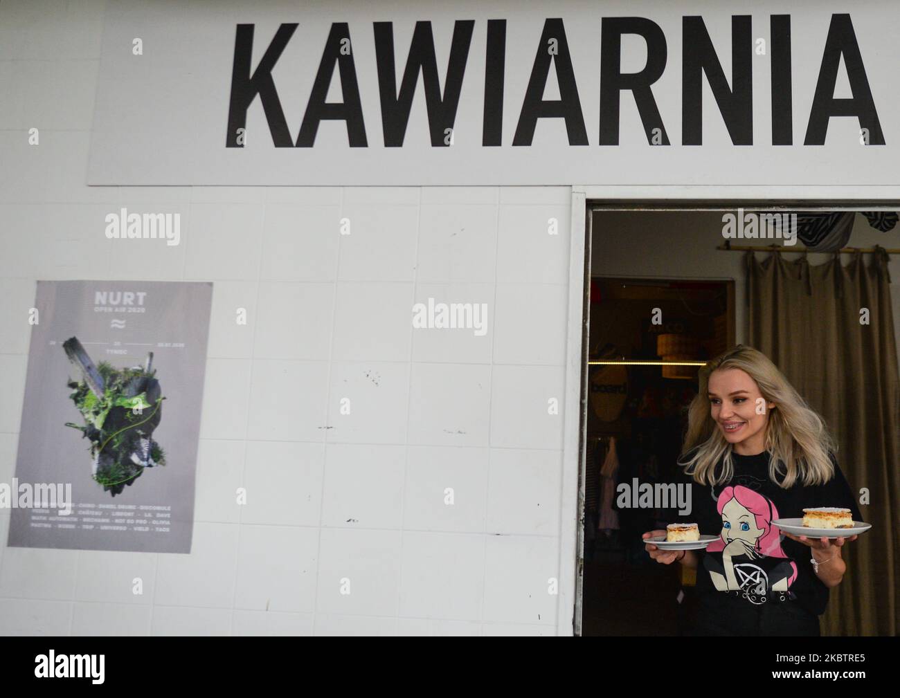 A waitress carries traditional 'Kremowka' - a Polish type of cream pie ...