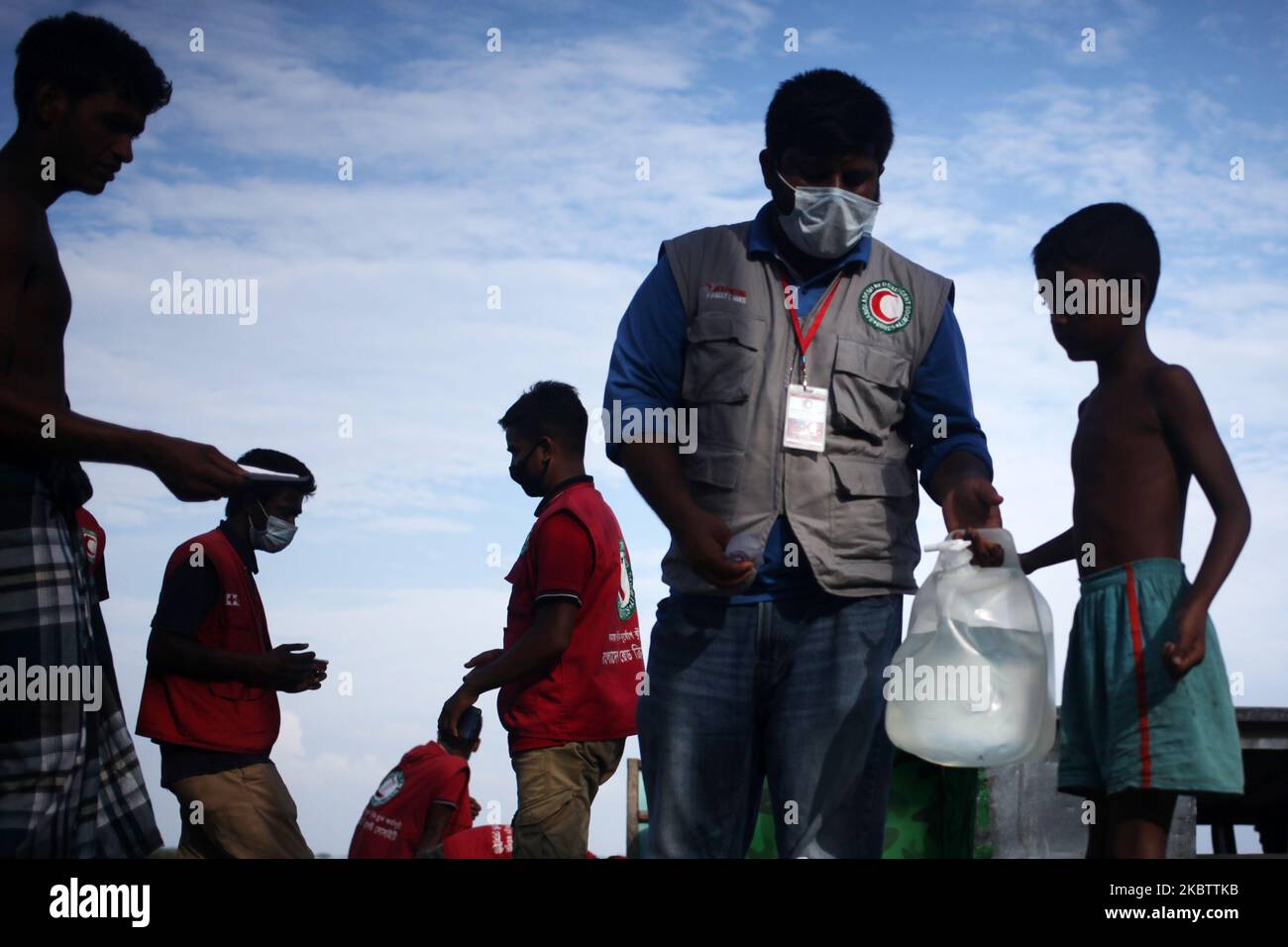 Flood-affected people collect pure drinking water from Bangladesh Red ...