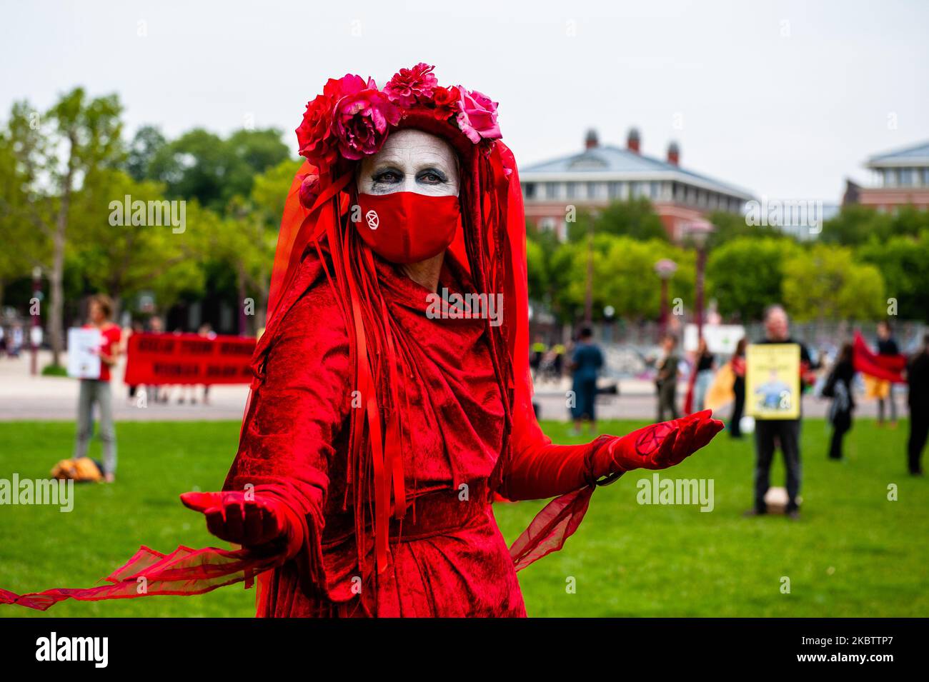 The Red Rebels are walking around the activists to show their support ...