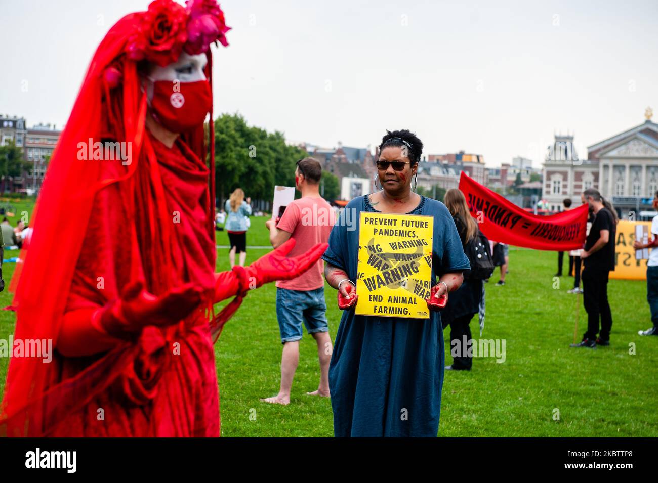 The Red Rebels are walking around the activists to show their support ...