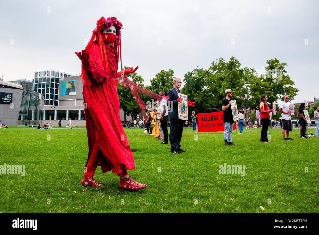 The Red Rebels are walking around the activists to show their support ...