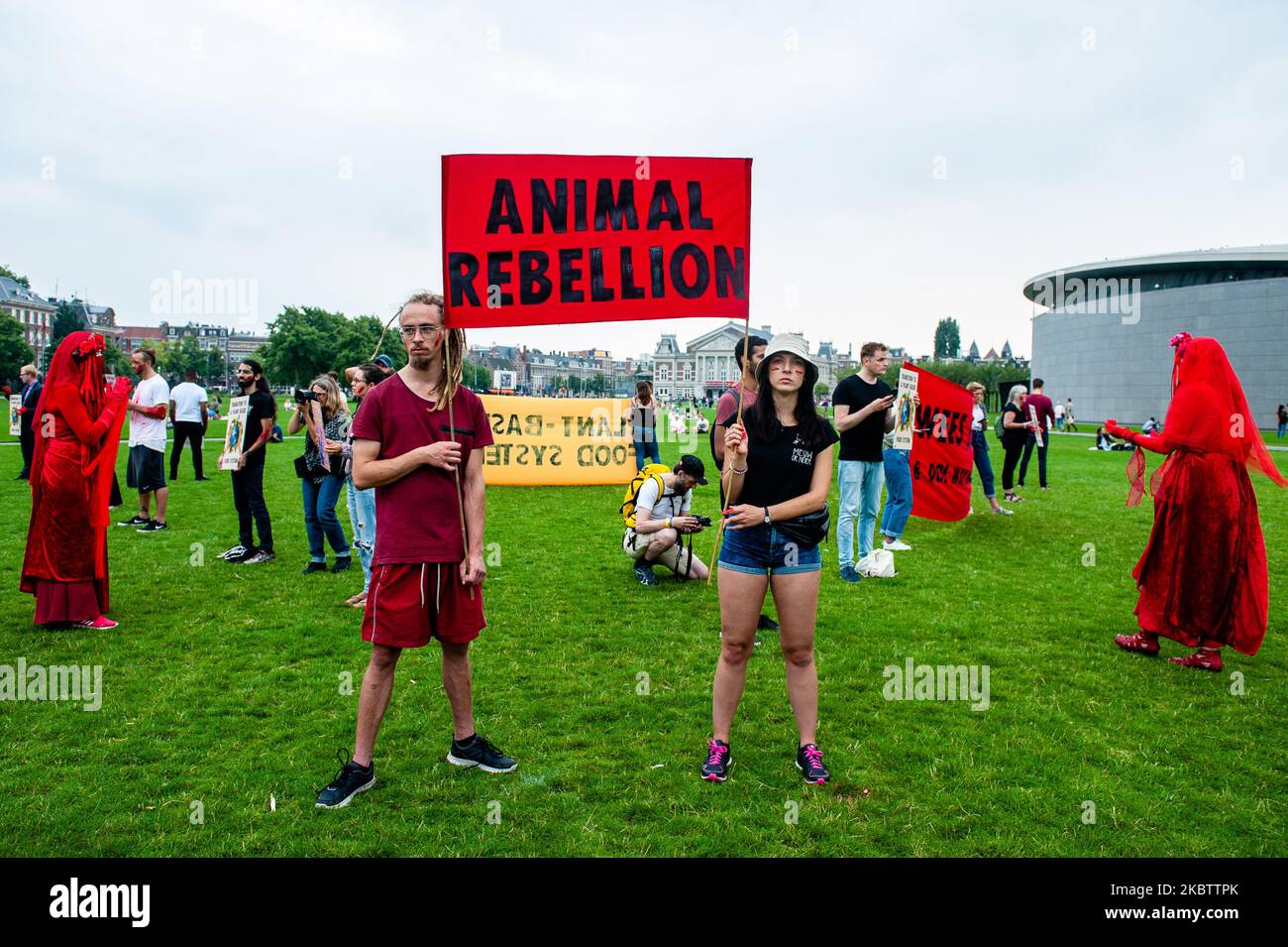 The Red Rebels are walking around the activists to show their support ...