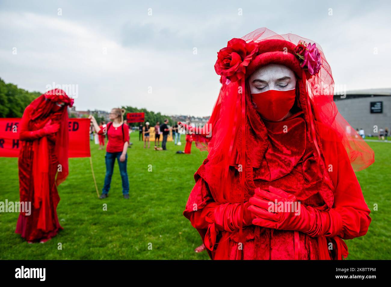 The Red Rebels are walking around the activists to show their support ...