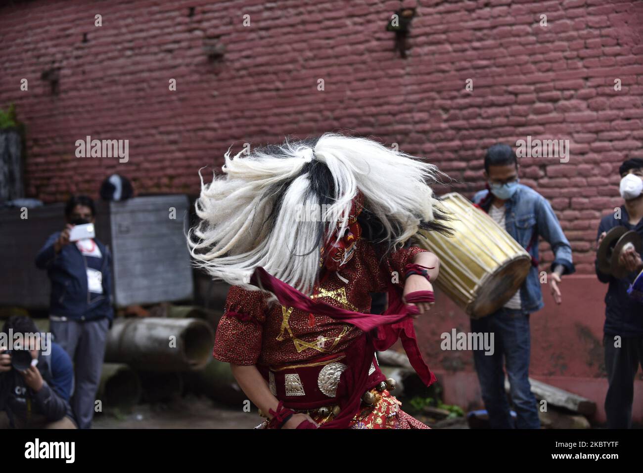 A mask dancer Lakhay performing traditional ritual dance during ...