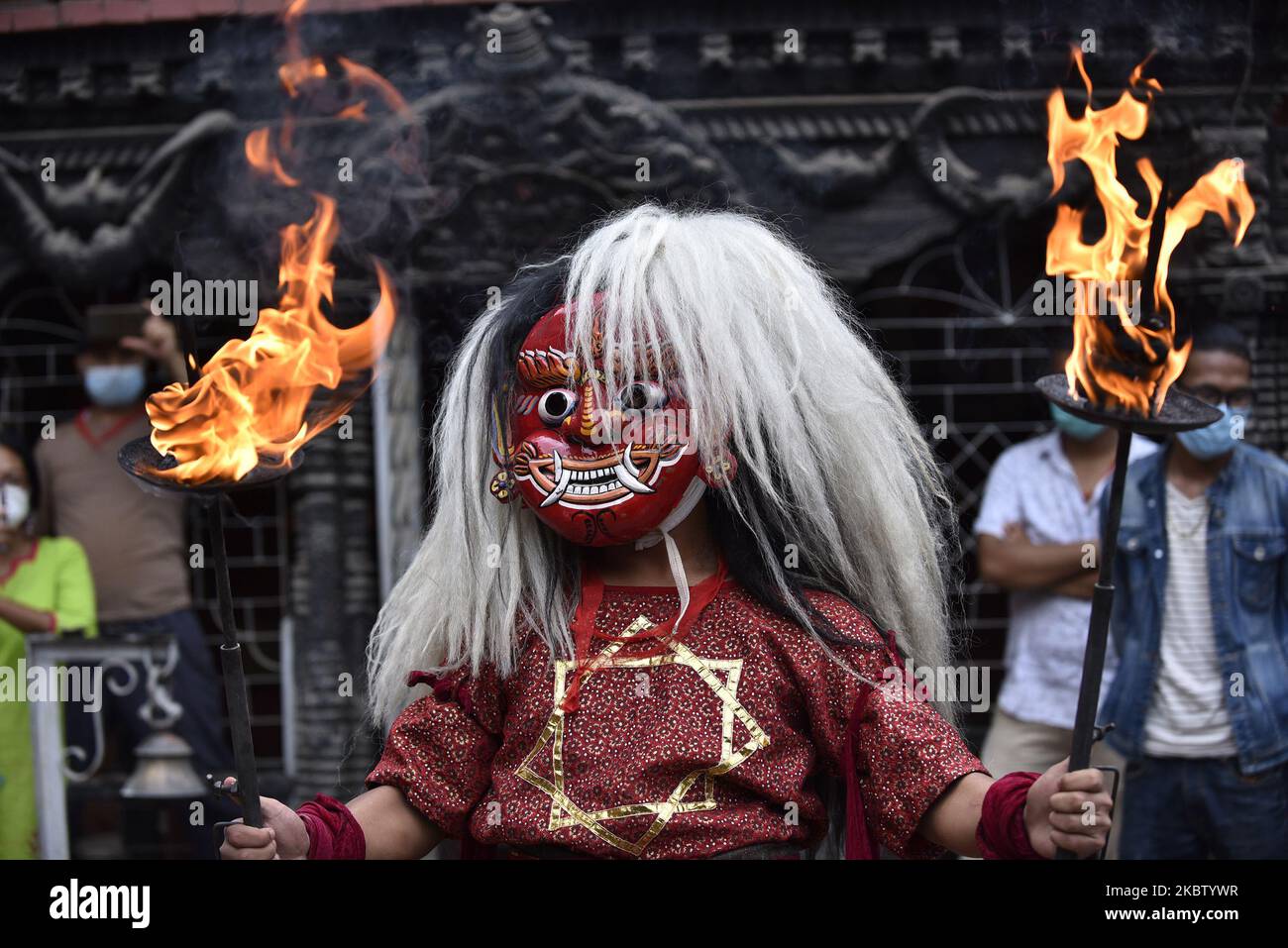 A mask dancer Lakhay performing traditional ritual dance during ...