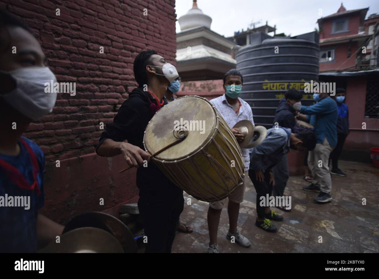 Nepalese devotees playing traditional instruments for the traditional ...