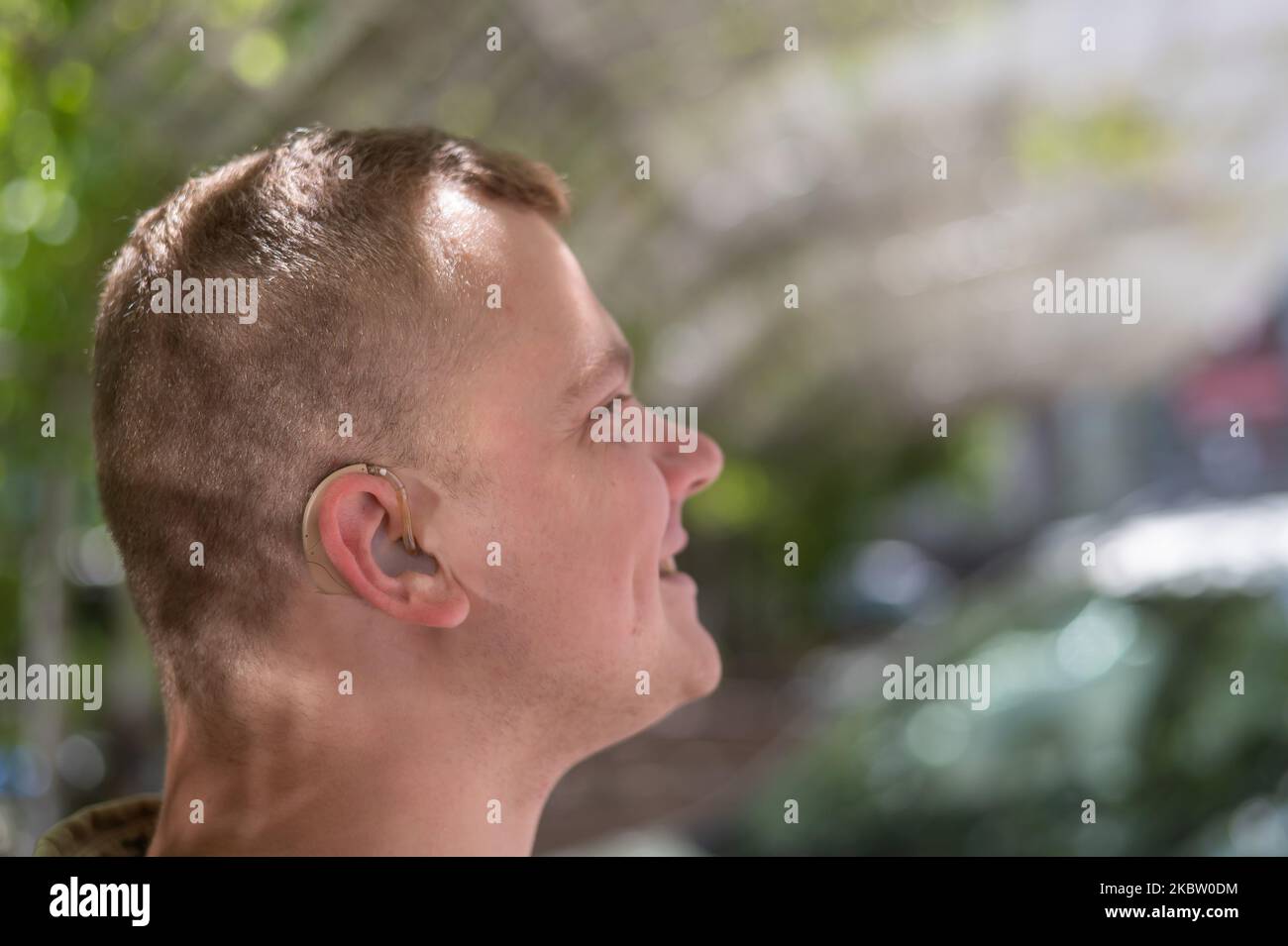 Close-up of a hearing aid on a man's ear Stock Photo - Alamy