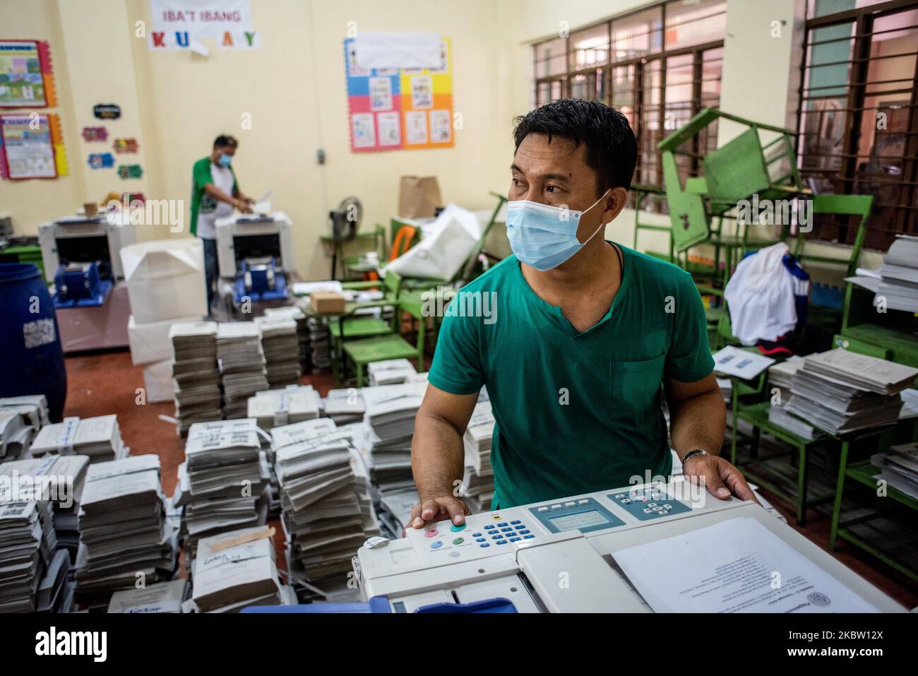 Teachers volunteer to photocopy learning materials to be used by ...