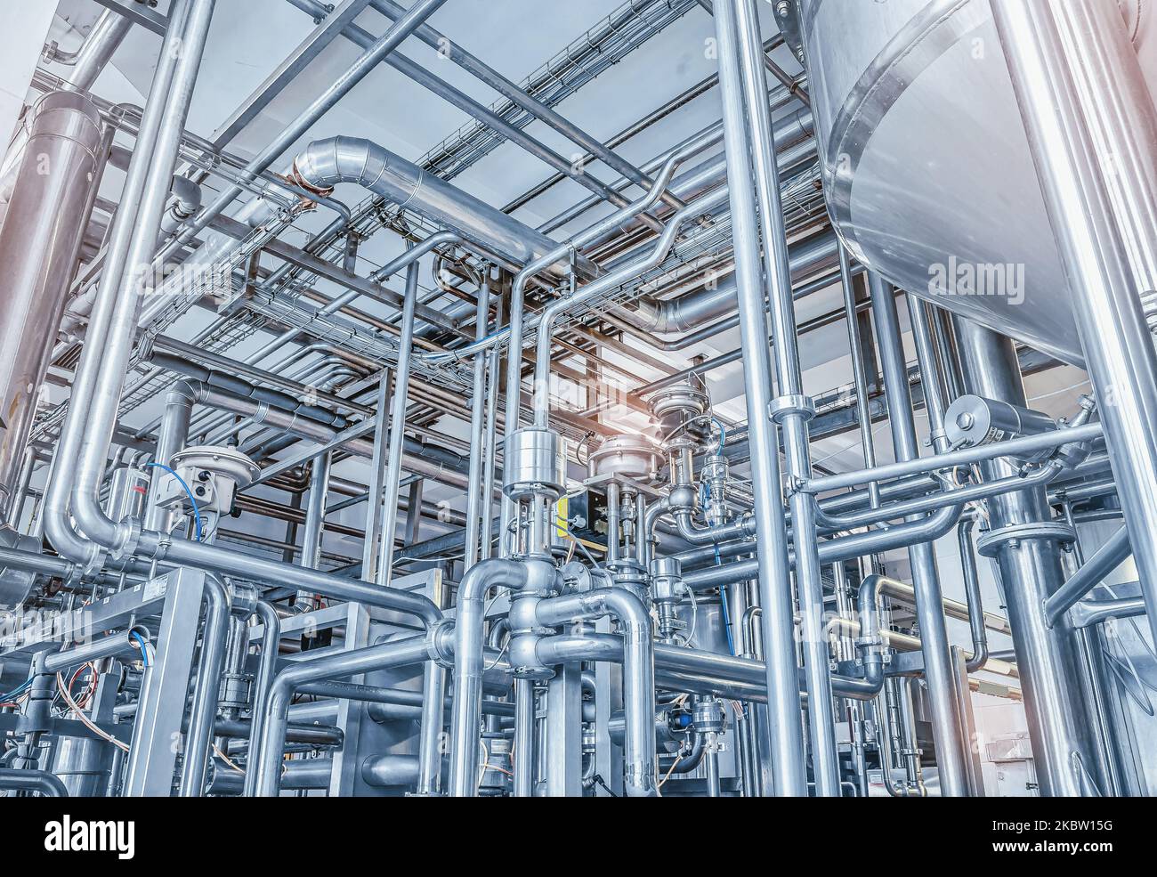 Stainless steel pipes in the factory. Construction on food production ...