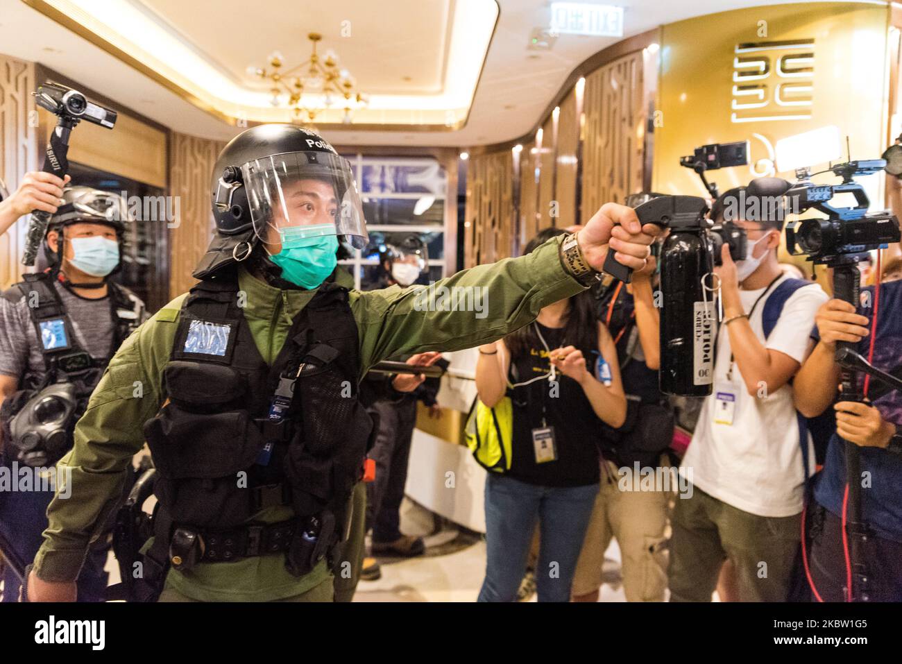 Policeman points pepper spray hi-res stock photography and images - Alamy