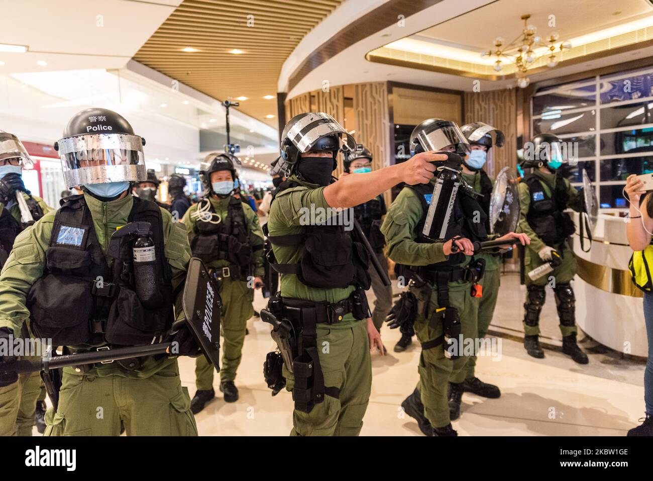 Policeman points pepper spray hi-res stock photography and images - Alamy