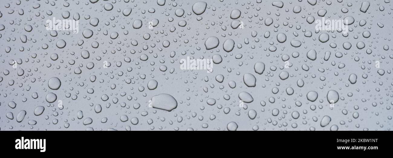 Closeup of raindrops on gray window glass texture background. . Rainy ...
