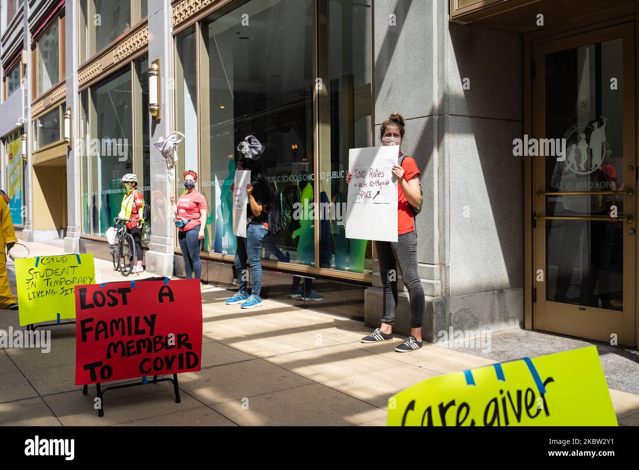 Chicago Teachers Union members and supporters protest during a car ...