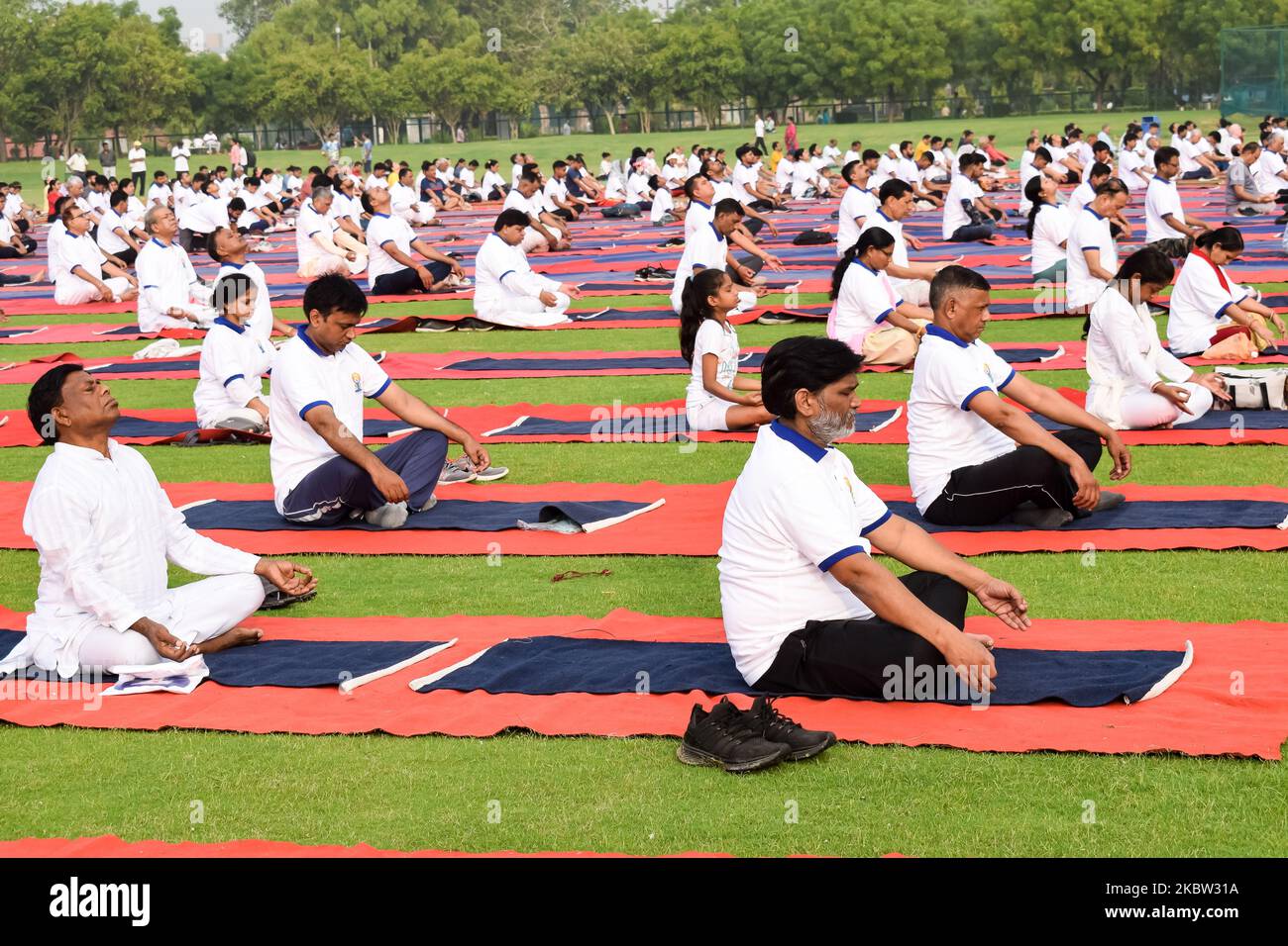 New Delhi, India, June 21 2022 - Group Yoga exercise session for people ...