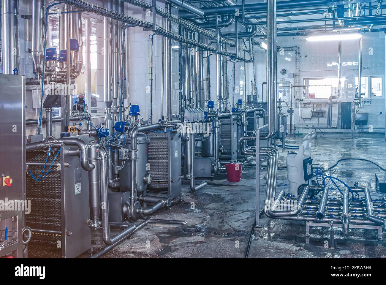 Milk reception point at dairy. A system of stainless steel pipes in ...