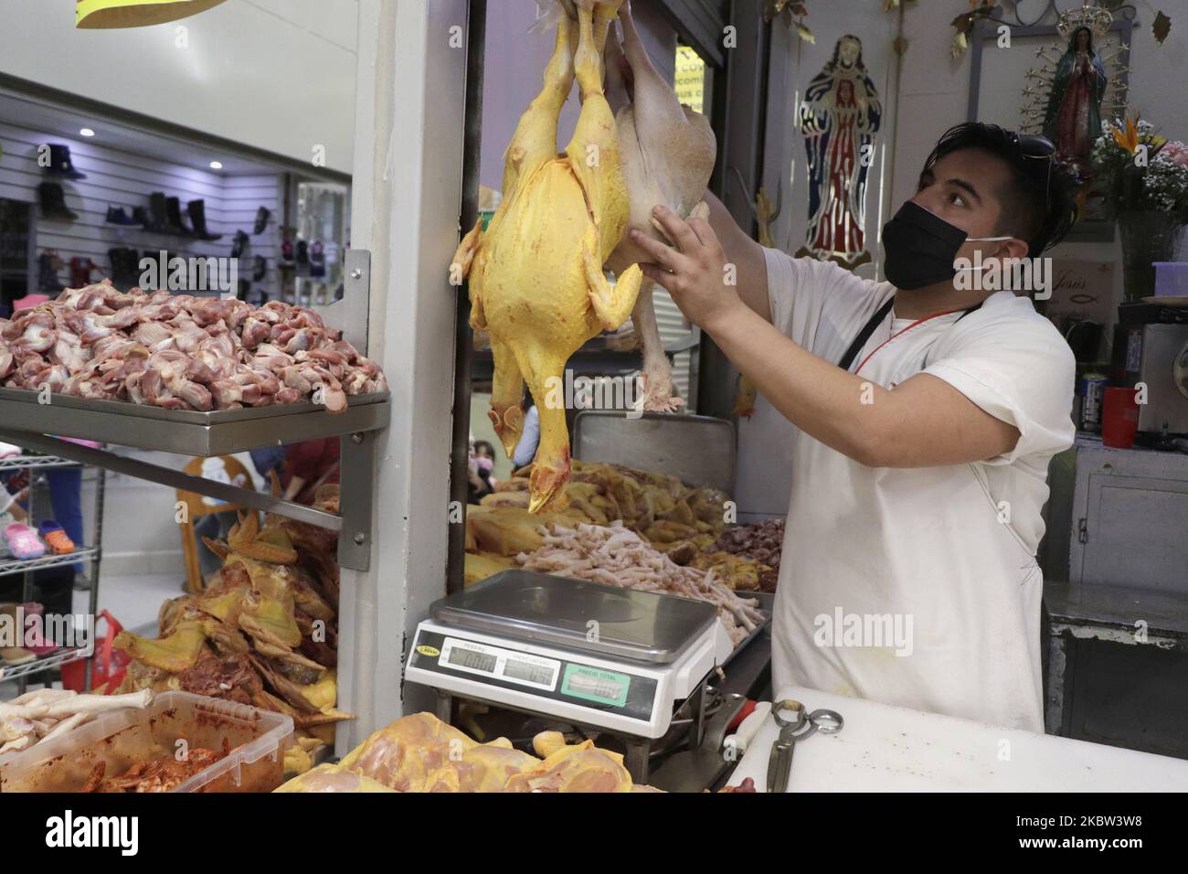 A chicken vendor at the Mercado Benito Juarez in the city hall of Milpa ...