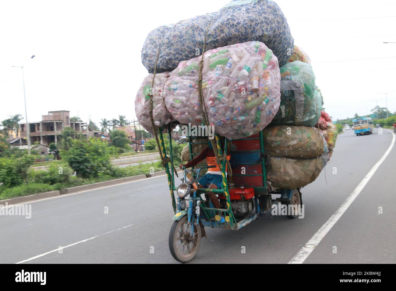 Electric rickshaw with Recyclable plastic scraps loaded on National ...