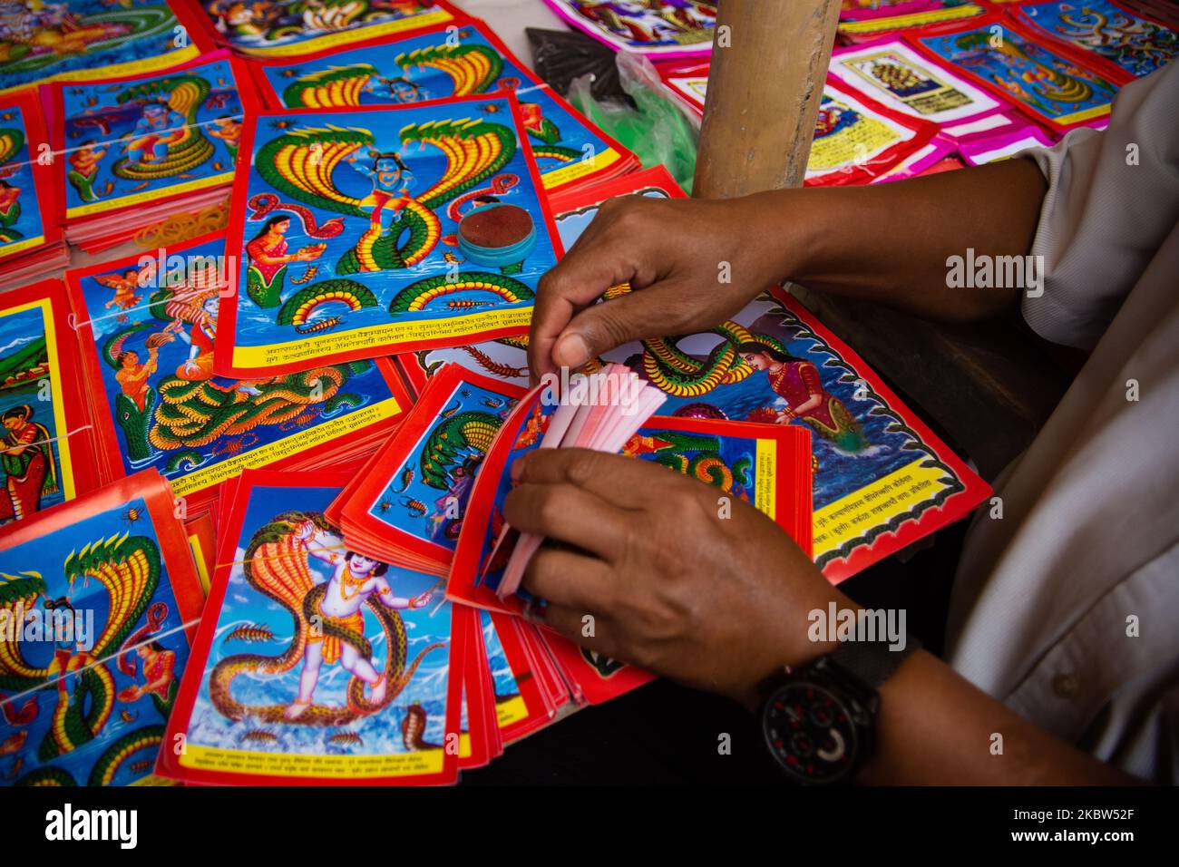 A Nepalese street vendor sells Nag Poster for the celebration of Nag ...