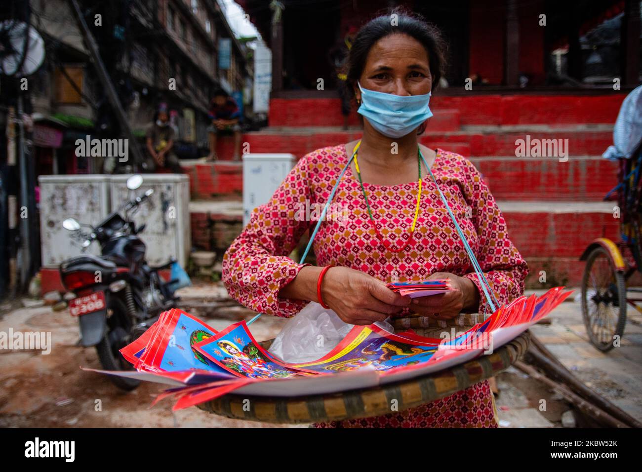 A Nepalese street vendor sells Nag Poster for the celebration of Nag ...